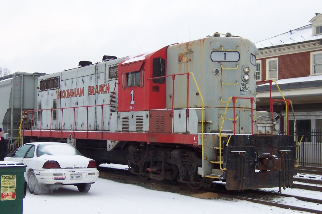 The old GP7 dwarfs the little pontiac